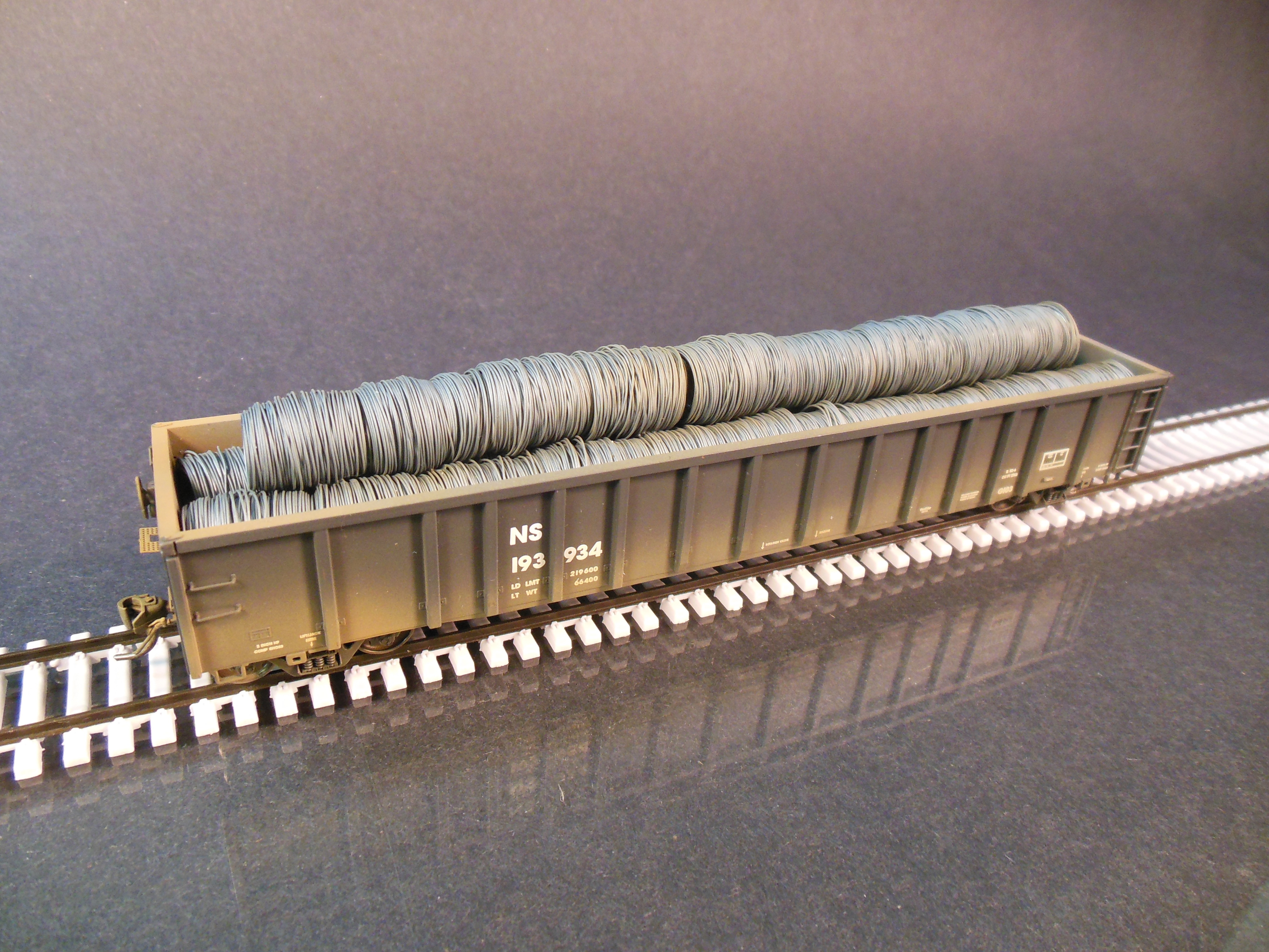 ExactRail HO scale gondola with coiled steel wire. -Protoloads