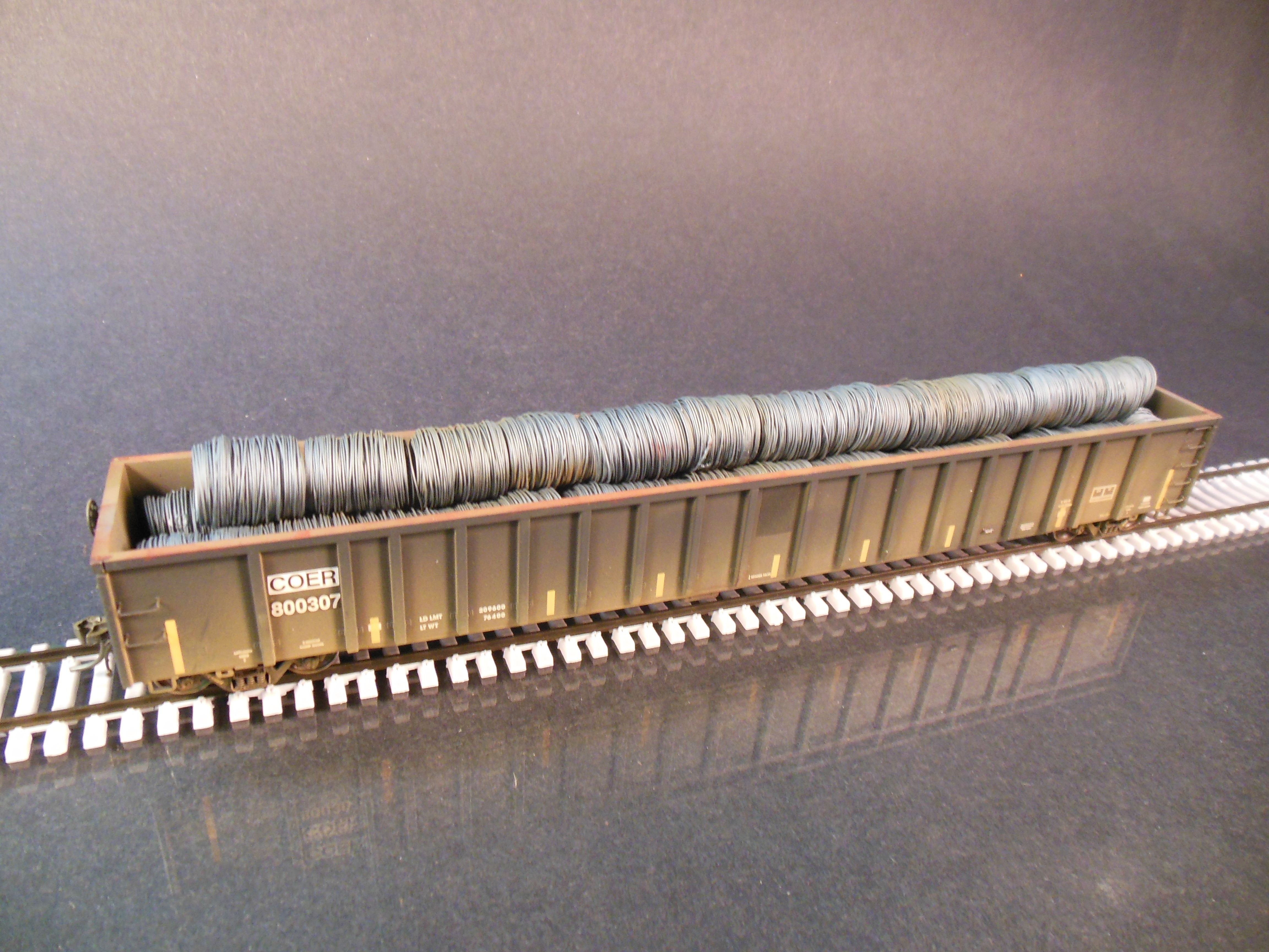 ExactRail HO scale gondola with coiled steel wire. -Protoloads
