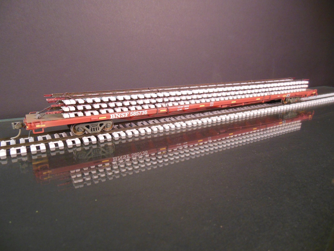 Atlas HO scale 89’ flatcar with concrete tie panel track -Protoloads