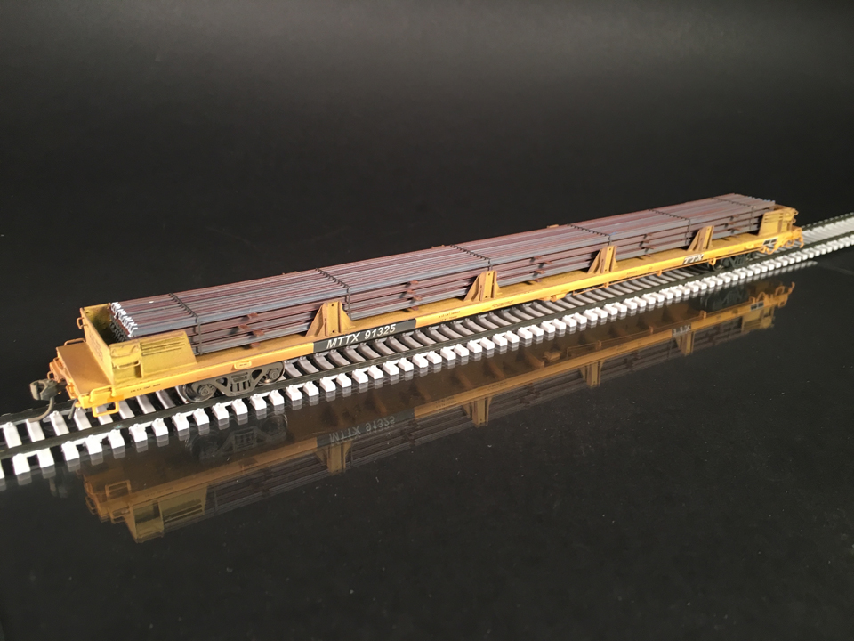 Atlas HO scale 89’ flatcar with new steel rail -Protoloads